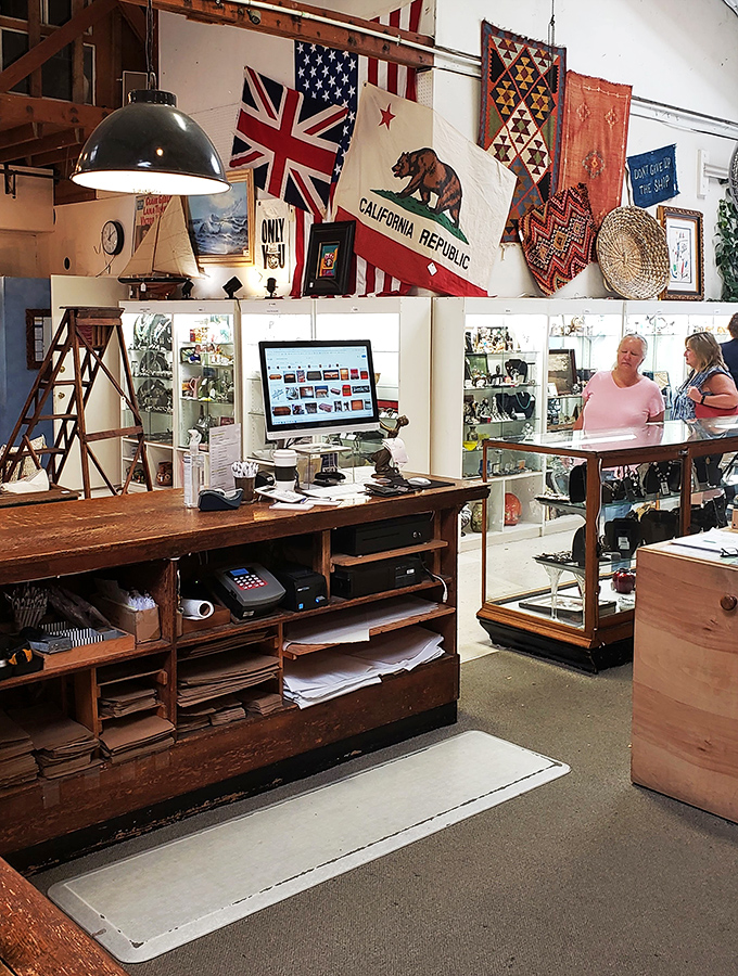 Even the cash register is a blast from the past! These folks look like they've struck gold in the antique wilderness.