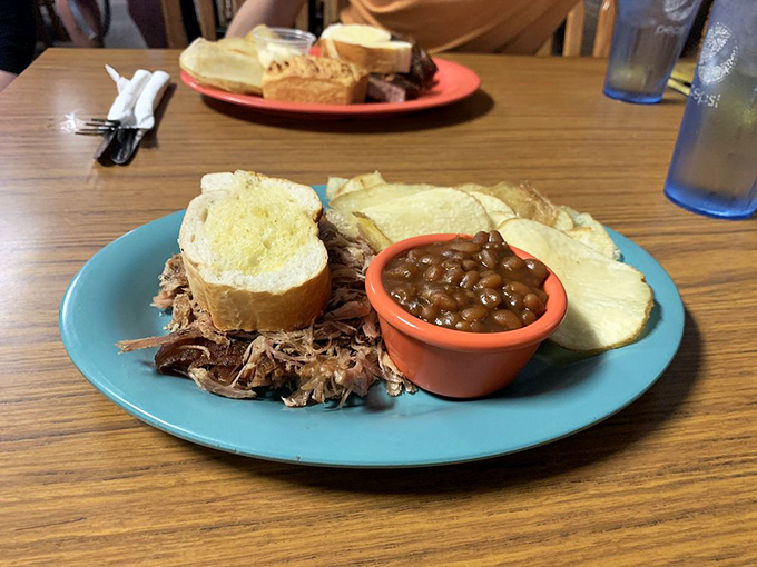 Pulled pork perfection: a mountain of meat so flavorful, you'll want to plant a flag on top and claim it as your own delicious territory.