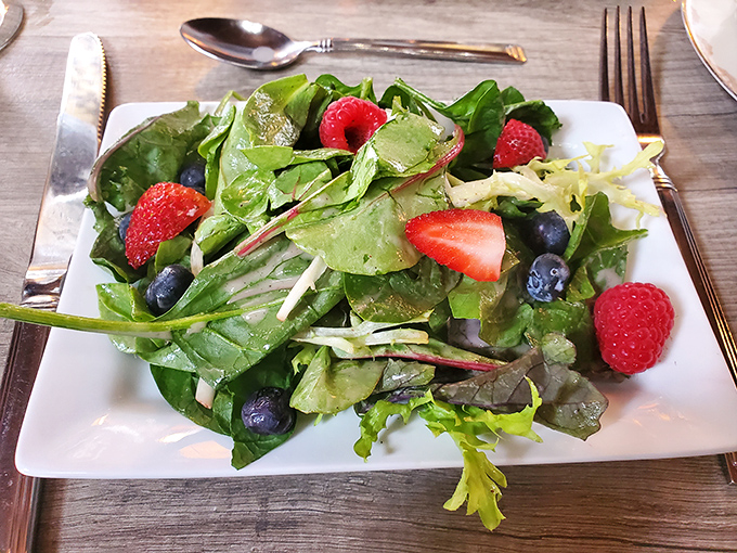 A salad that's anything but boring! This vibrant mix of greens and berries is like a garden party in your mouth.