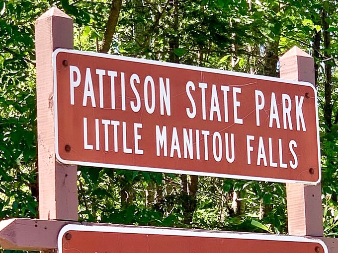 The sign says it all - you're in for a treat! Little Manitou Falls: where big adventures come in small packages.