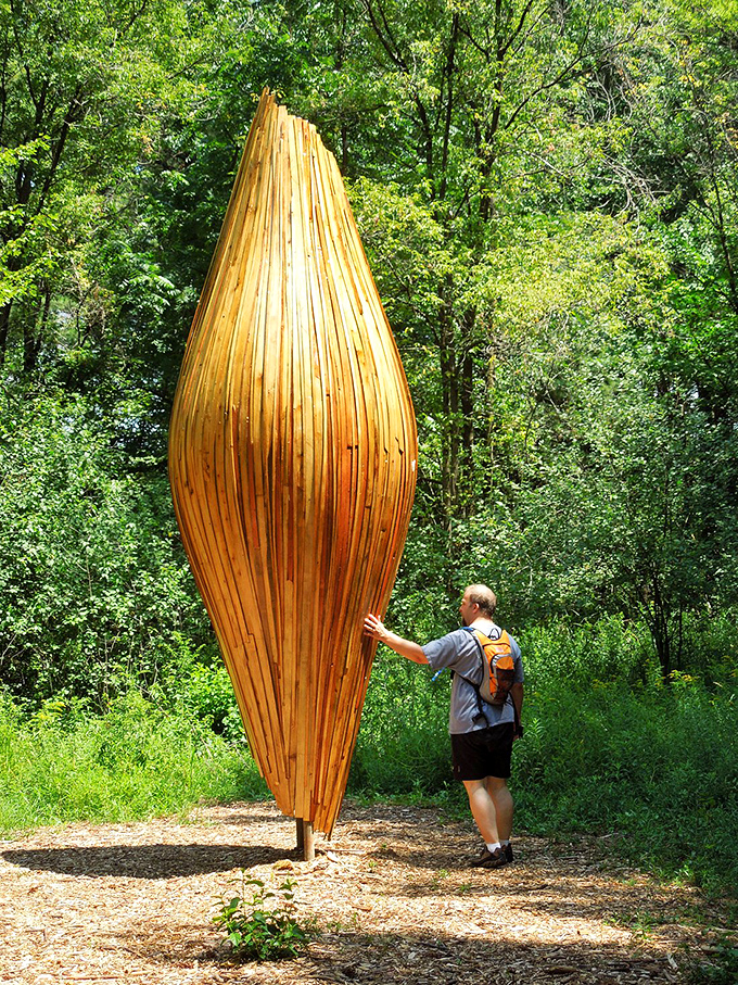 "Does this sculpture make me look tall?" This wooden wonder towers over visitors, inviting them to reach for the sky &ndash; literally.