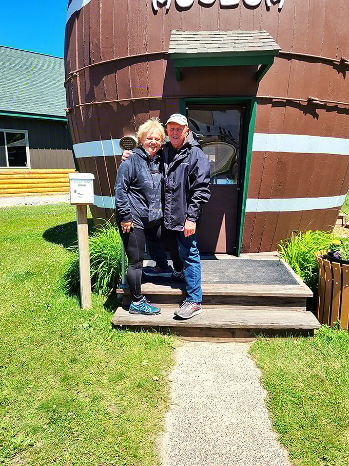 Smile, you're on pickle camera! Happy tourists pose outside this quirky attraction, proving that sometimes the best memories come in peculiar packages.