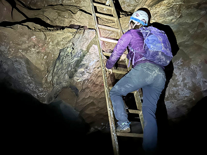 Up, up, and away! This cave explorer is giving new meaning to the phrase 'climbing the corporate ladder.