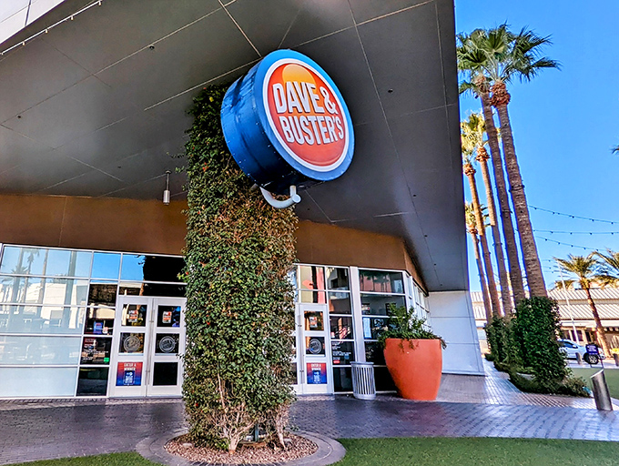 Dave & Buster's: Where adulting meets arcade fun! Palm trees and neon signage beckon you to this oasis of games and gigantic cocktails.