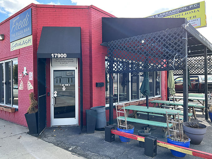 Fredi The PizzaMan: Where pink walls meet piquant pies! This colorful corner is serving up slices with a side of sass.