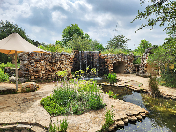 A peaceful retreat where nature&rsquo;s beauty steals the show, complete with a stone waterfall cascading into a tranquil pond. It's like stepping into a secret garden designed for serenity and inspiration.