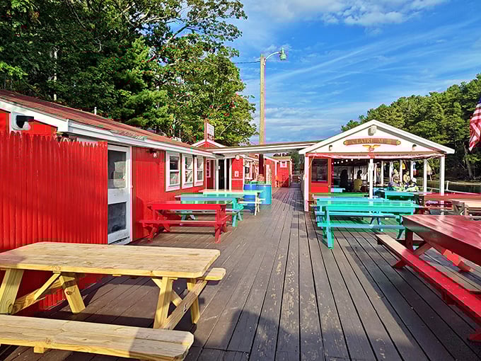 The waterside deck at Chauncey Creek offers front-row seats to nature's dinner show, with lobster as the headlining act.