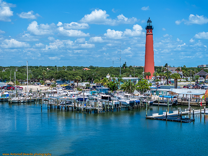 Where land meets sea: Ponce Inlet's maritime sentinel. This red brick giant has been guiding ships and dazzling visitors since before electricity was cool.