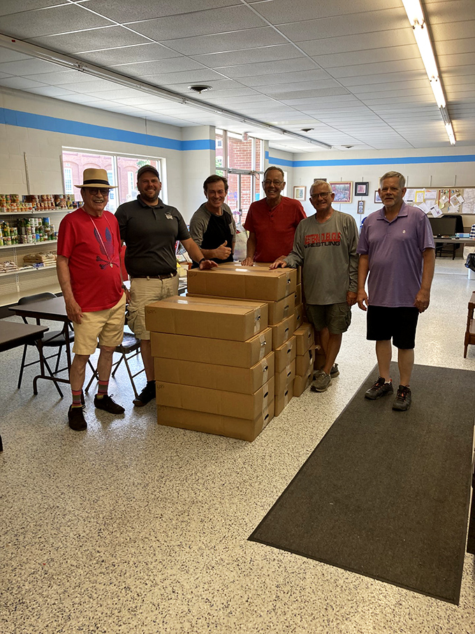 These volunteers aren't just unpacking boxes &ndash; they're unpacking possibilities! St. Vincent de Paul: where every purchase has purpose.