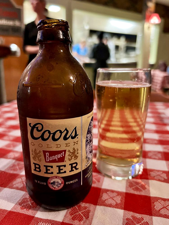 Cheers to tradition! Nothing says "classic pizza night" quite like an ice-cold Coors alongside your piping hot slice.