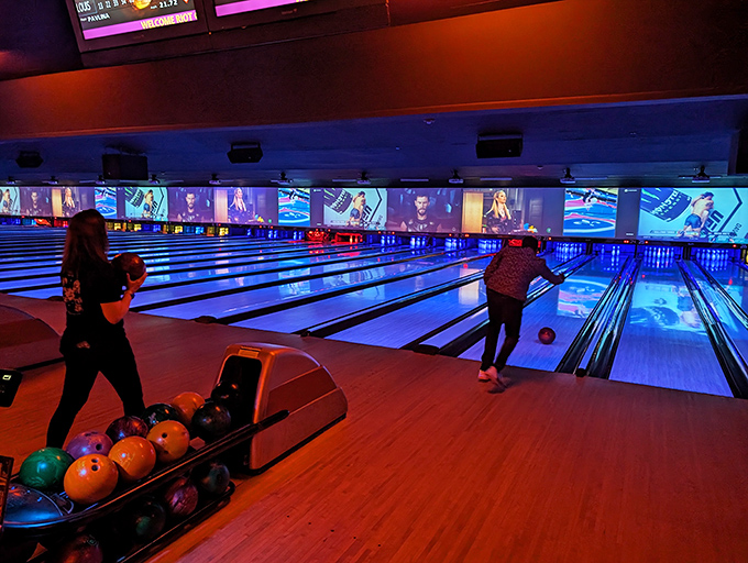Lanes alive with the sound of strikes! Watch as bowlers channel their inner Lebowski in this neon-lit paradise.