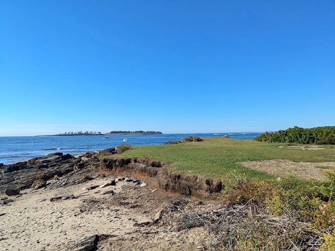 Rocks, grass, and endless blue - it's as if Earth decided to show off all its best features in one stunning view.