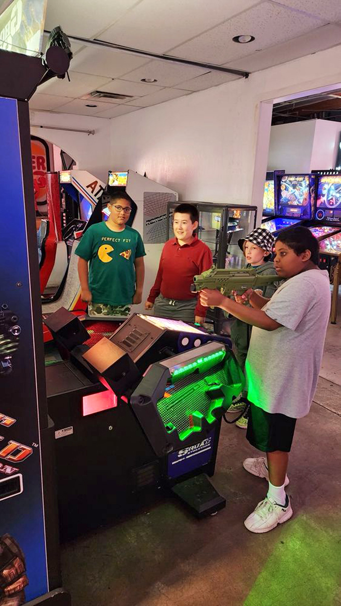 Squad goals, arcade edition. These young guns are learning the ancient art of cooperative play &ndash; and probably planning their next sugar rush.