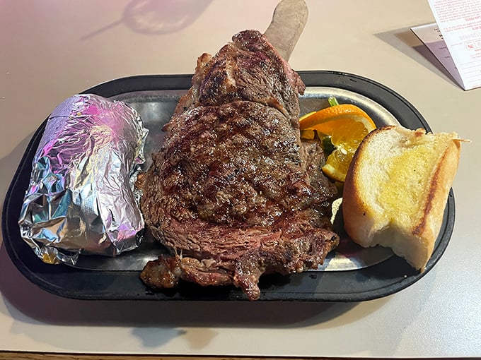 Holy cow! This ribeye is big enough to have its own ZIP code. Carnivore heaven on a plate.