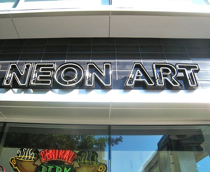 The writing's on the wall - or should I say, the building? This sign is your beacon to a world of illuminated wonders.