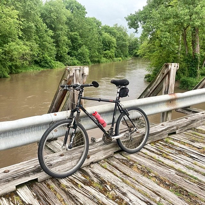 Bike meets bridge in a standoff of steel and wood. Who will blink first in this showdown over Kickapoo's scenic waterways?