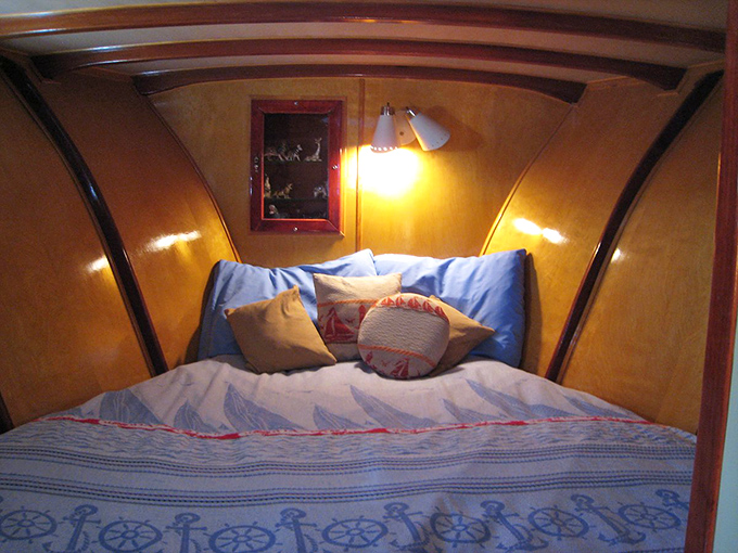 Sweet dreams are made of this: a cozy bed nestled in a vintage trailer. It's like sleeping in a time capsule, minus the stale air and plus some seriously comfy pillows.