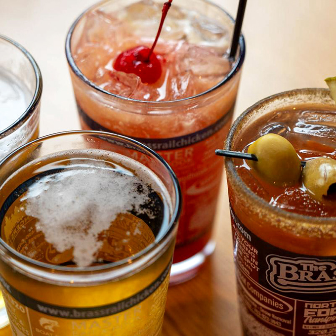 Liquid refreshment lineup! From frosty brews to colorful cocktails, there's a sip for every palate at The Brass Rail.
