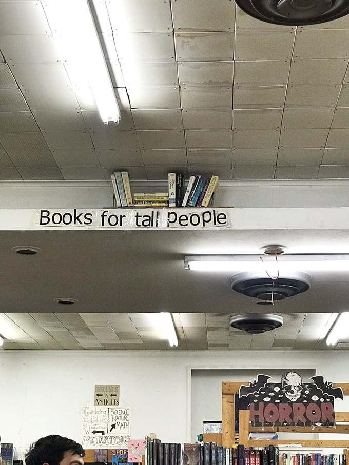 Reaching new heights of humor! This clever shelf for tall readers proves that Recycled Books has a sense of humor as elevated as its inventory.