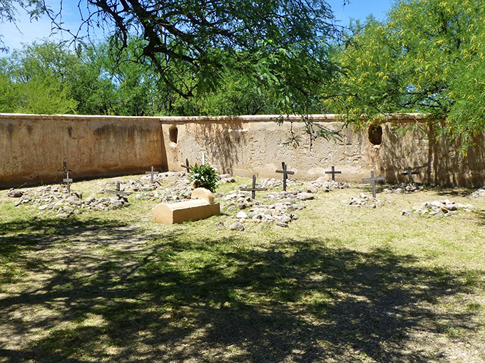 A solemn reminder of lives past. These weathered crosses stand as silent storytellers, each one a chapter in the mission's epic tale.