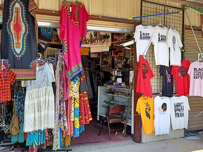 A kaleidoscope of culture and style. This clothing booth is a vibrant celebration of diversity, from dashikis to graphic tees.