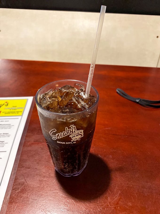 Quench your thirst in style! Sneaky's branded cup isn't just a drink, it's a badge of honor for chicken connoisseurs.