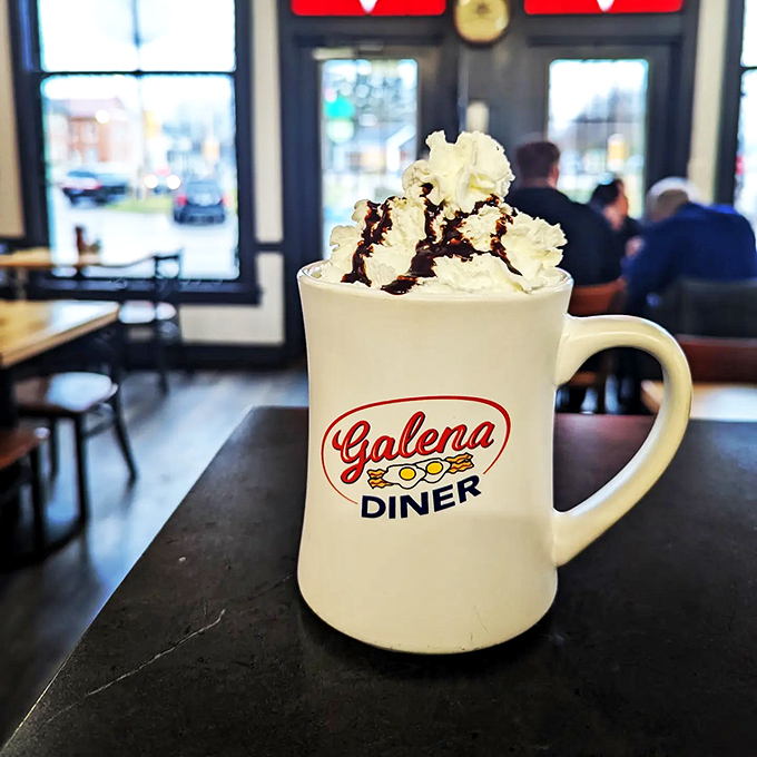 Hot cocoa that's dressed to impress! This mug of happiness is topped with enough whipped cream to make you consider using it as a pillow.