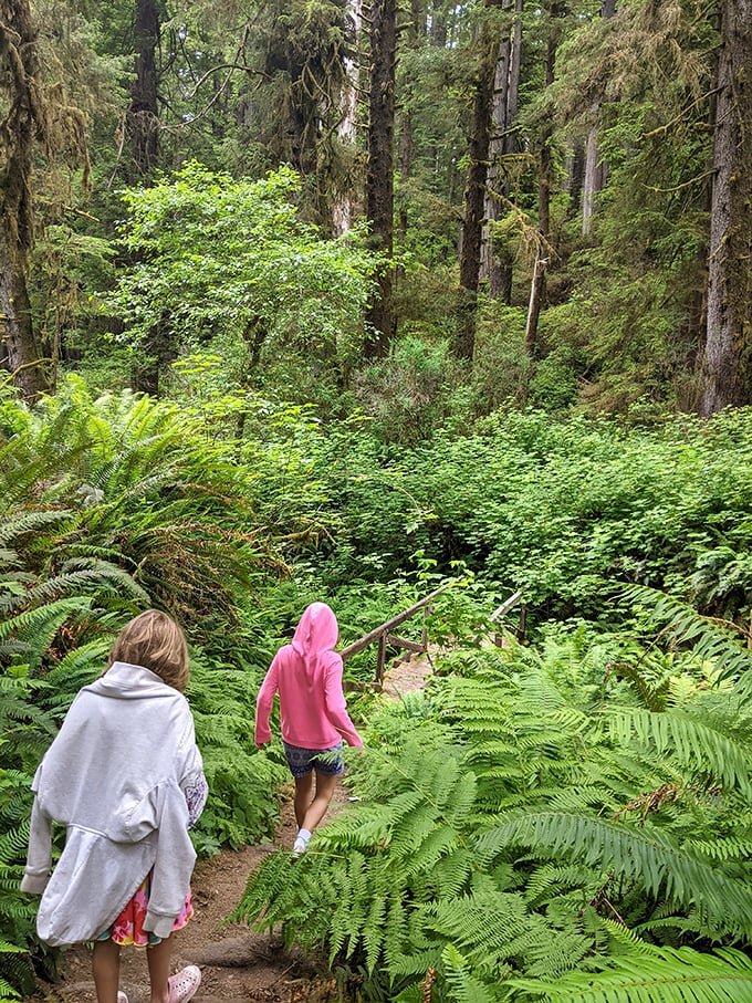 Pink hoodie meets Jurassic Park. These kiddos are getting their daily dose of wonder, with a side of "don't touch that" parental warnings.