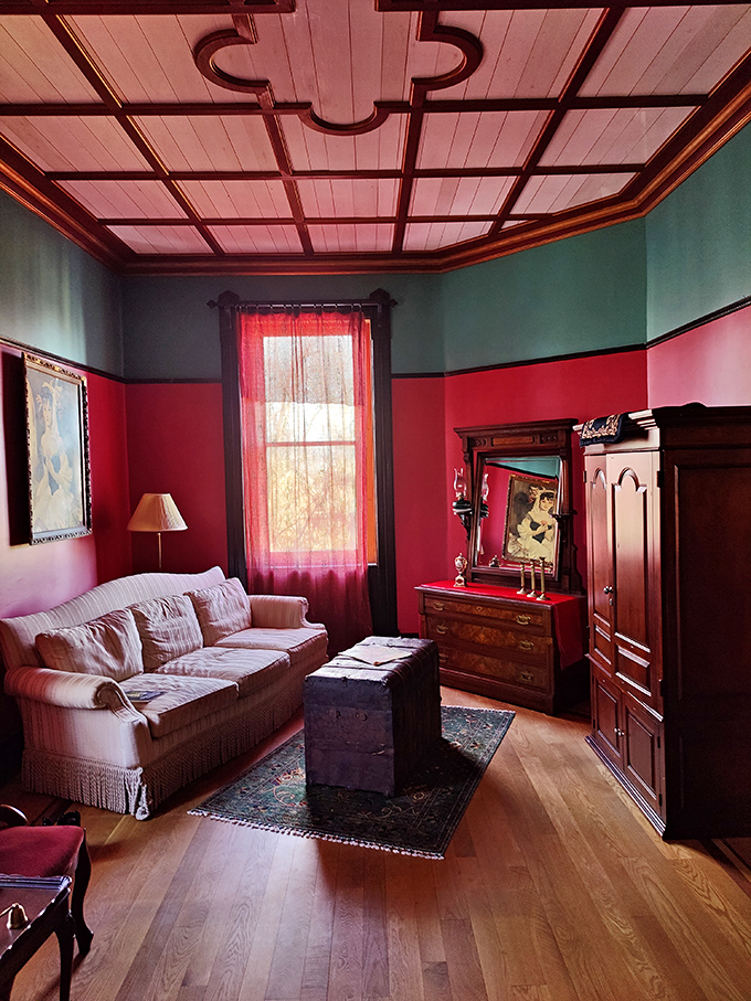 Fifty shades of red never looked so inviting. This cozy nook is perfect for curling up with a good book &ndash; or communing with spirits.