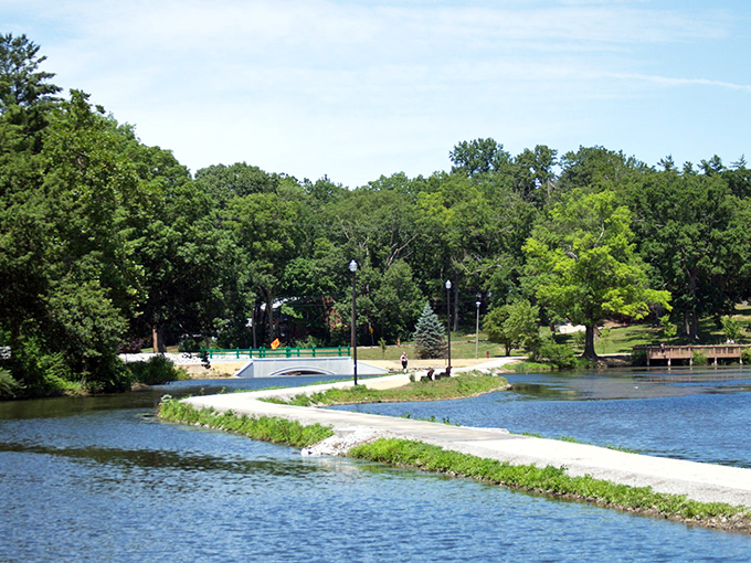 Mirror, mirror in the park: These tranquil waters reflect the beauty above, doubling the visual feast for lucky visitors.