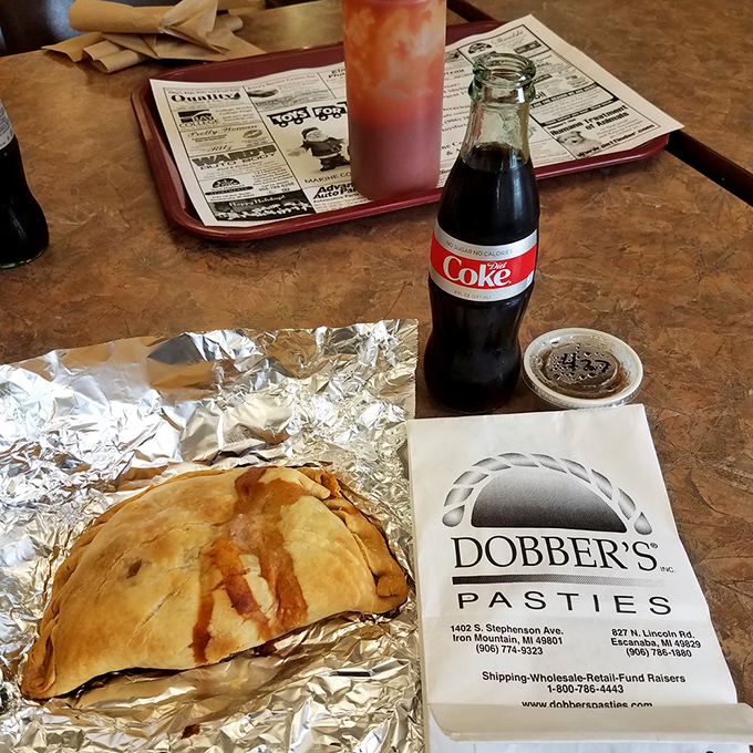 The classic combo: a hearty pasty and an ice-cold Coke. It's like the Midwest's answer to fish and chips.