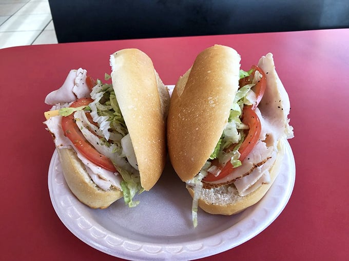 Sandwich goals! This sub is stacked higher than a Jenga tower, promising a mouthwatering adventure with every bite. No hard hat required.