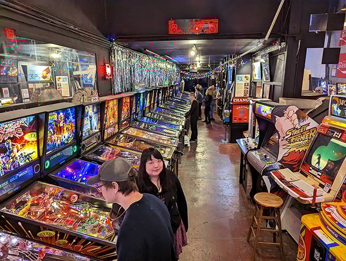 Pinball alley or memory lane? This corridor of flashing lights and ringing bells is a stroll through gaming history.
