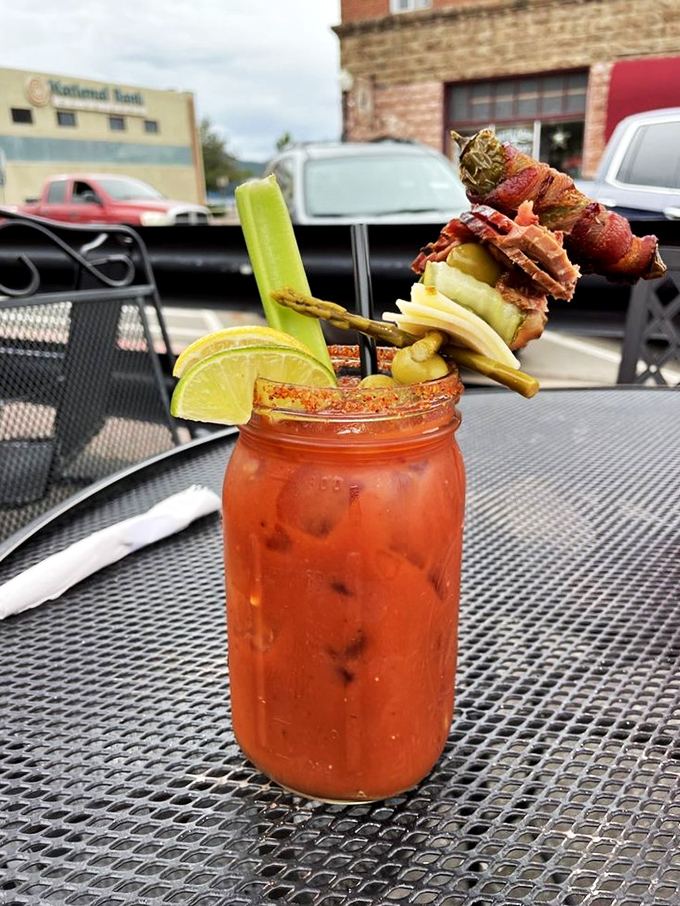 This Bloody Mary is more loaded than my aunt's gossip at Thanksgiving dinner. It's a meal in a glass, with enough garnish to count as your daily veggie intake.