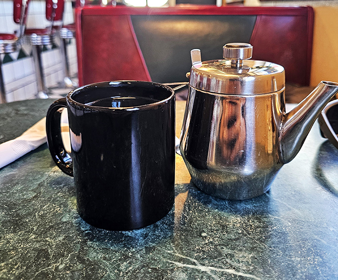 The dynamic duo of diner dining: A steaming cup of joe and a classic silver pot. Name a more iconic breakfast pair &ndash; I'll wait.