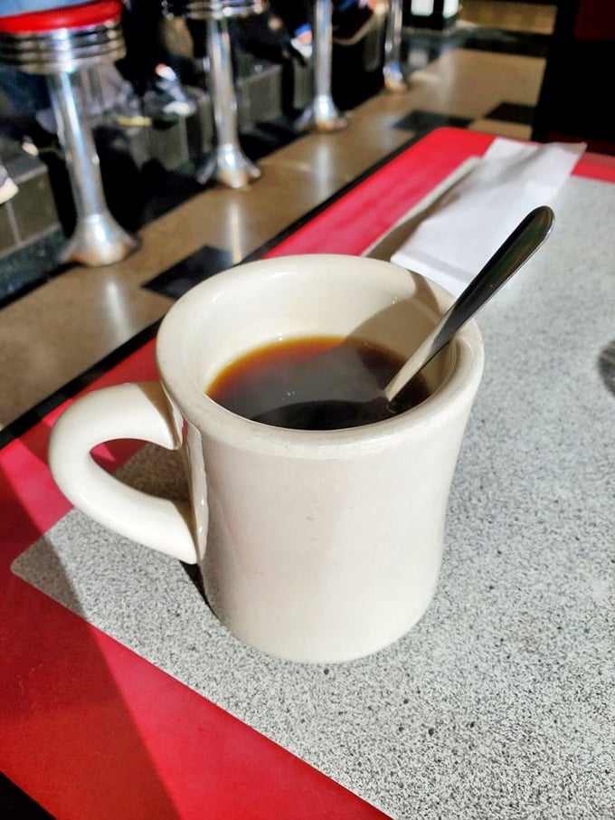 The elixir of life, diner-style. This isn't just coffee; it's liquid motivation served in a no-nonsense mug. No fancy latte art needed.