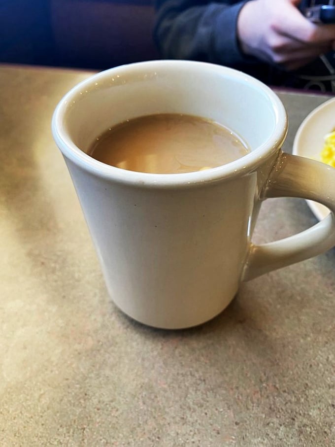 The elixir of life, diner-style. This humble mug holds the power to transform even the grouchiest morning grump into a ray of sunshine.