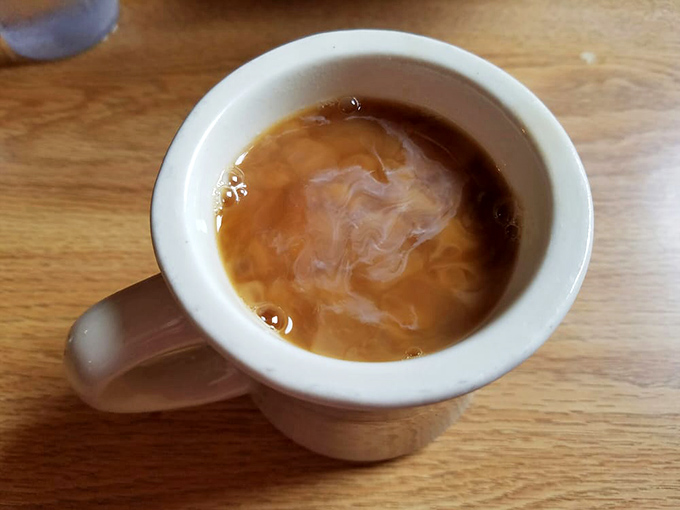 Steam rising from a fresh cup of joe &ndash; nature's alarm clock. This isn't just coffee; it's liquid motivation to face the day.