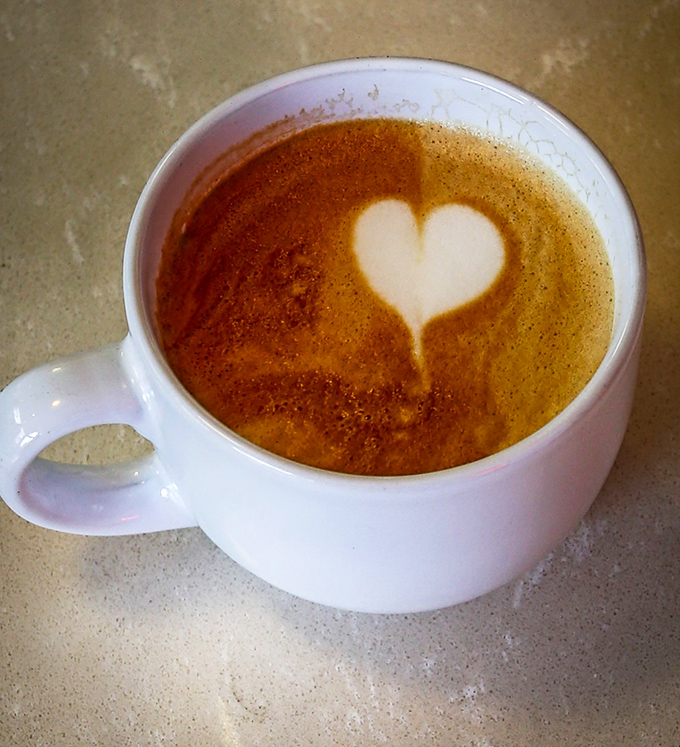 Love at first sip! This heart-topped latte isn't just a drink, it's a warm hug in a mug. Caffeine and affection, the perfect morning duo.