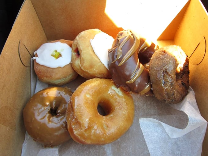A box of happiness! This assortment of donuts is like a flavor roulette &ndash; every bite's a winner, no matter where you land.