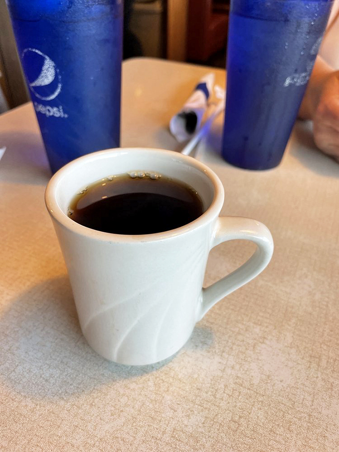 Coffee: the elixir of morning heroes. This mug holds liquid motivation, with a side of small-town charm.