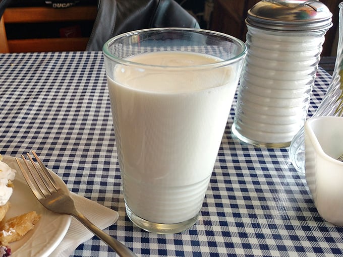 The ultimate comfort drink in its natural habitat. This glass of milk is practically begging for a cookie companion.