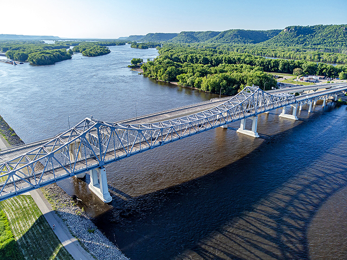 Bridge over calm waters: Engineering meets artistry. This bridge is working harder to connect people than a small-town matchmaker.