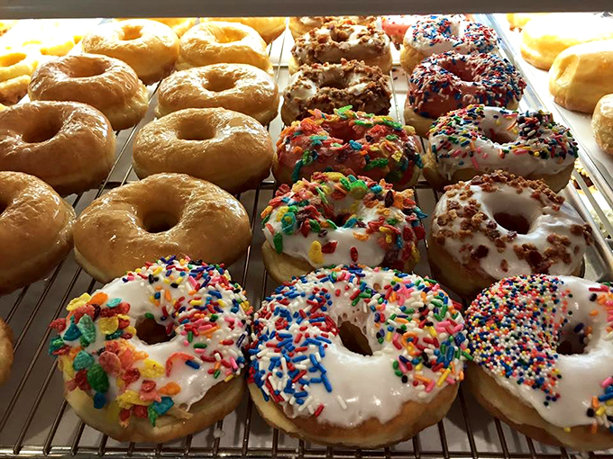A box of happiness, served fresh daily! This assortment is like the Avengers of the donut world – each with its own superpower to brighten your day.