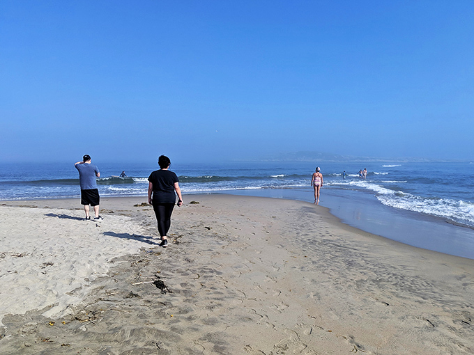 Beach therapy in session: where every step is a stress-buster. These folks are walking their worries away, one sandy footprint at a time.