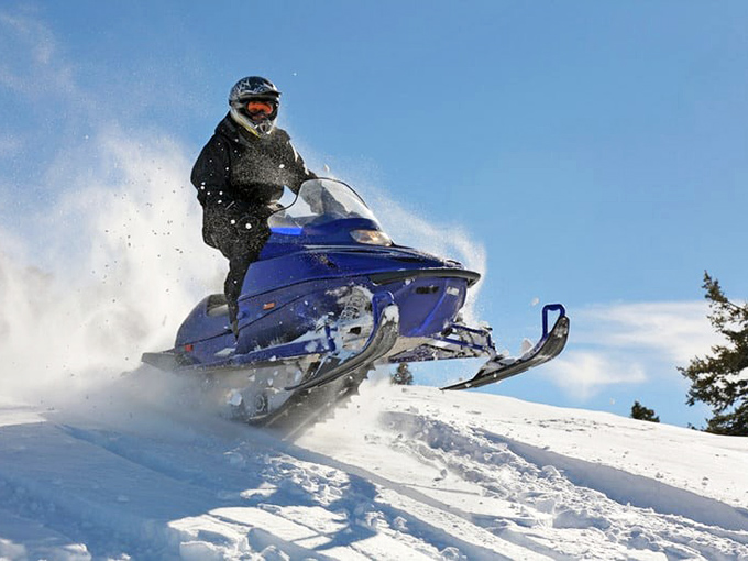 Snowmobiling thrills: Zoom through Petoskey's winter wonderland faster than Santa on Christmas Eve. Who needs reindeer when you've got horsepower?