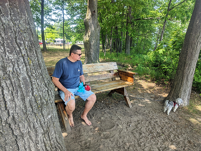 The art of perfecting the vacation slouch. This bench-dweller has mastered the fine balance between "taking it all in" and "contemplating a nap."