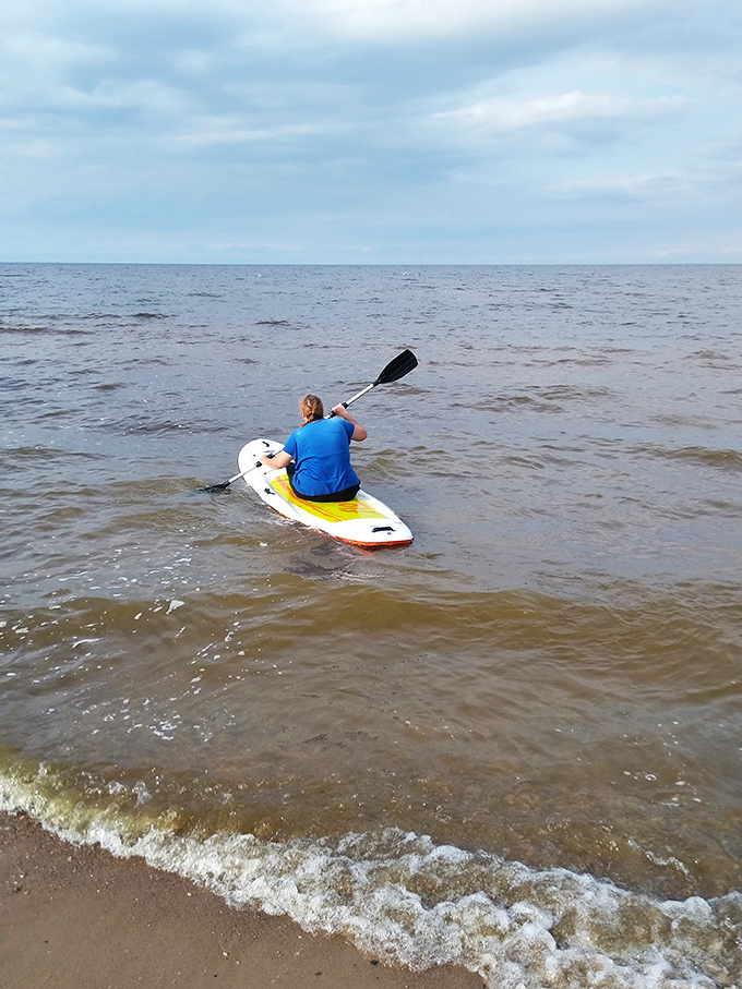 Paddle power: Where every stroke is a step away from the daily grind. This kayaker proves that sometimes the best therapy is a paddle and a whole lot of water.