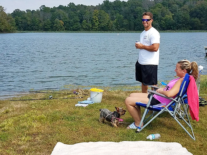 Lakeside lounging at its finest! These folks have mastered the art of doing nothing - and doing it spectacularly well. It's like a masterclass in relaxation.