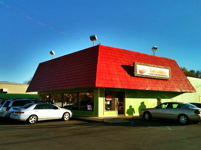 La Familia Morales: Flint's red-roofed wonder! It's like finding a pot of gold at the end of a salsa-colored rainbow.